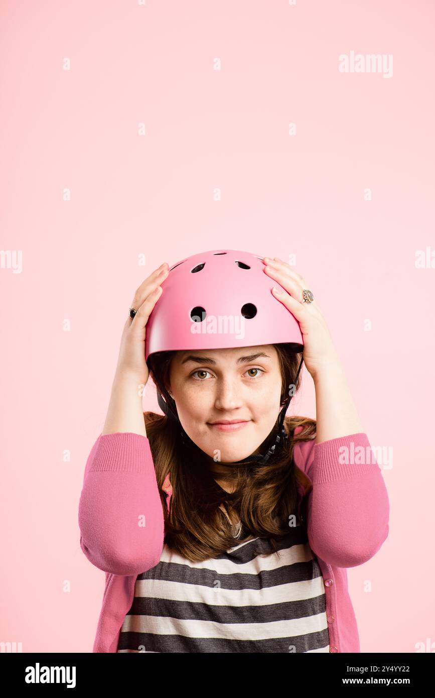 Cycling, helmet and portrait of girl in studio with confidence, travel ...