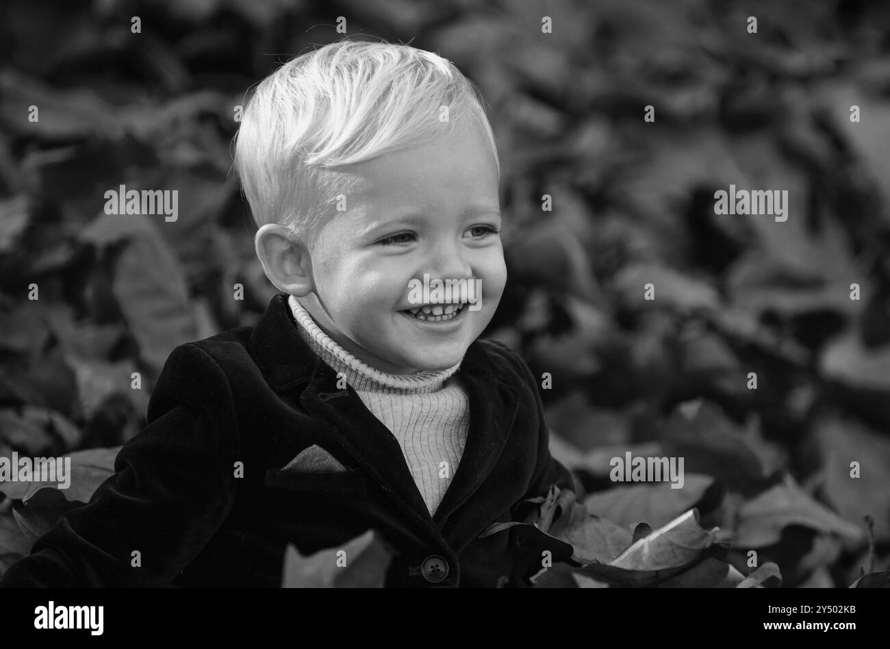 Happy child playing with fallen leaves in autumn park. Autumn dream ...