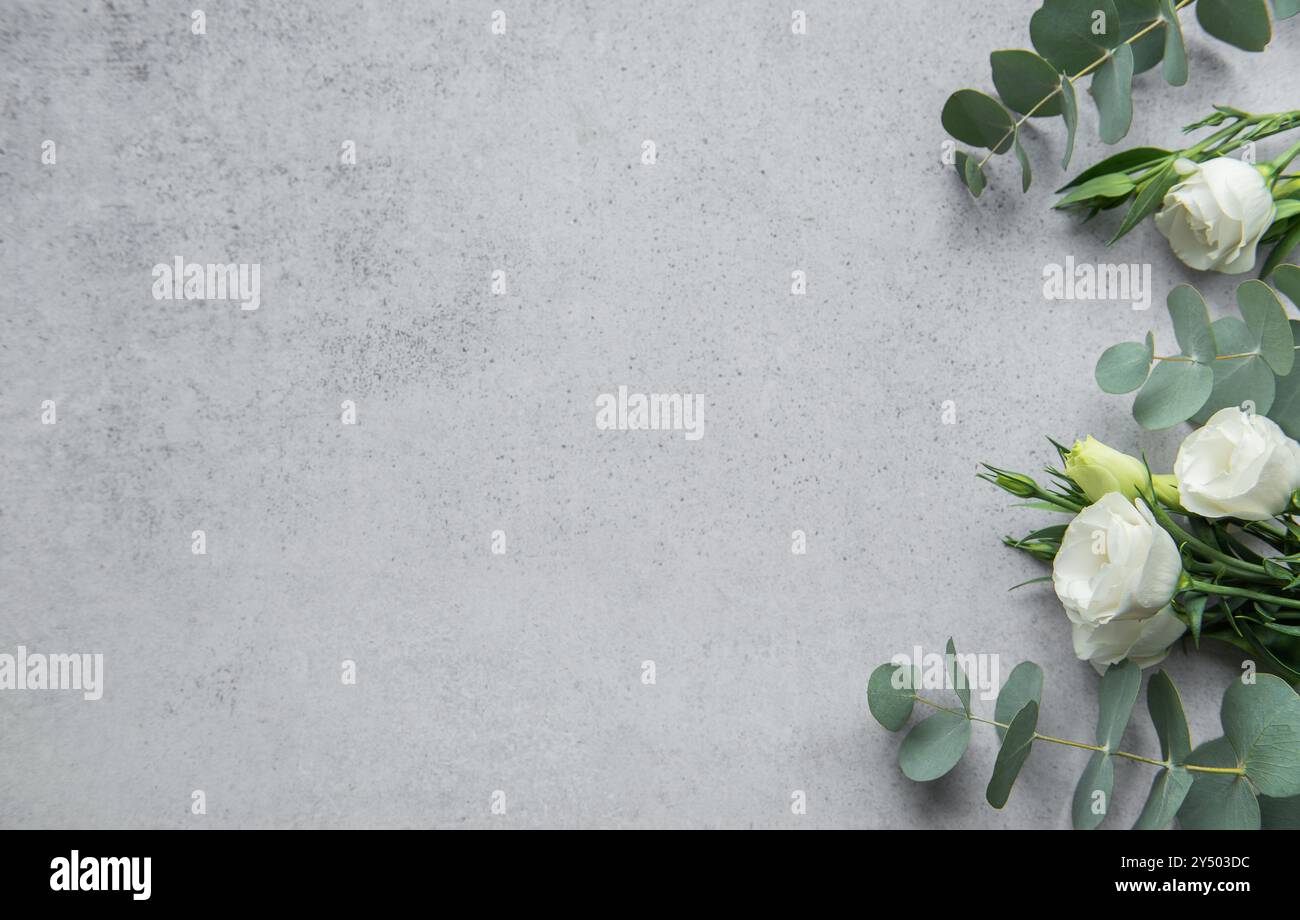 A beautiful assortment of pink, white, and cream flowers are artfully ...