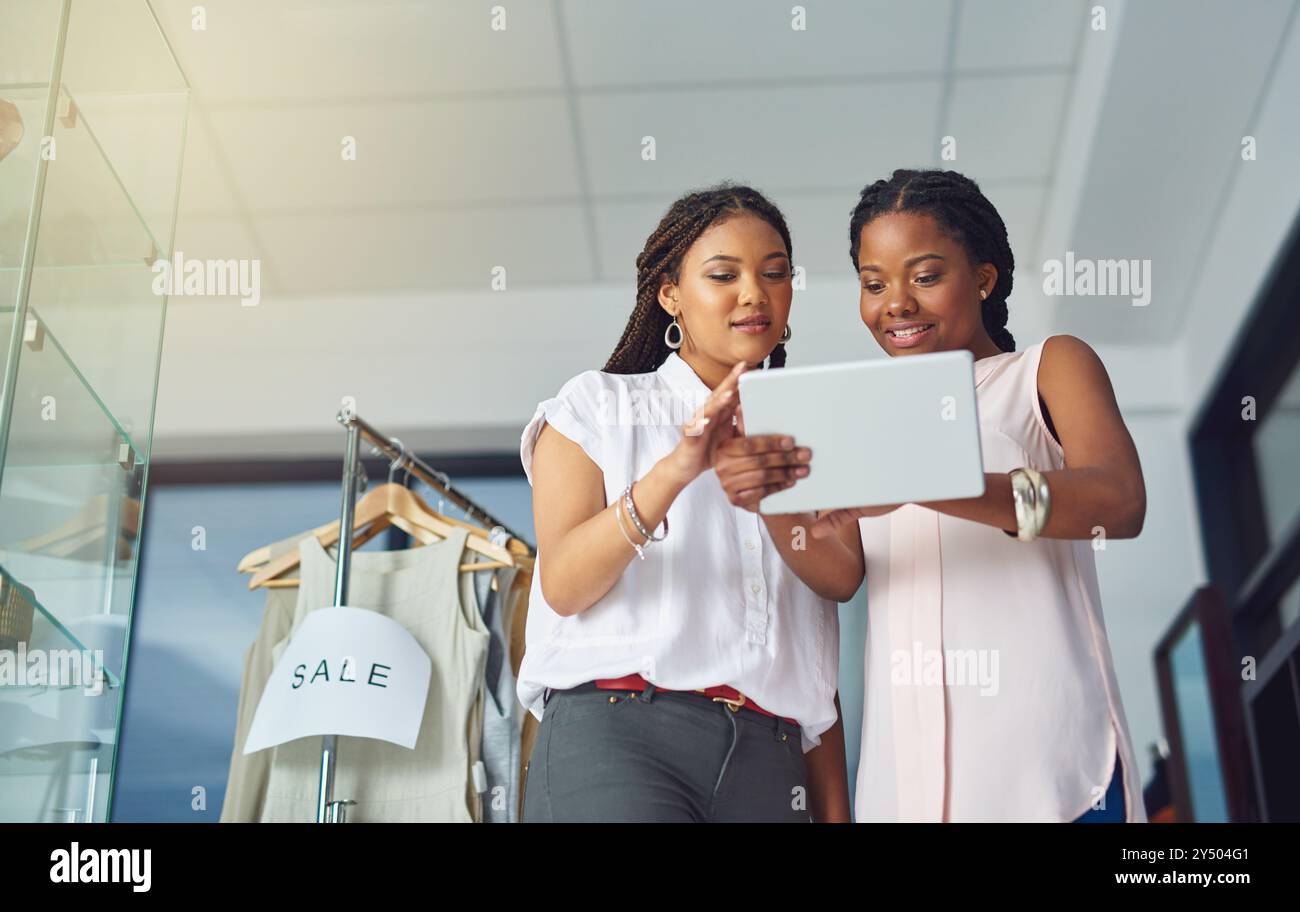 Small business, women and teamwork with tablet for fashion, track ...