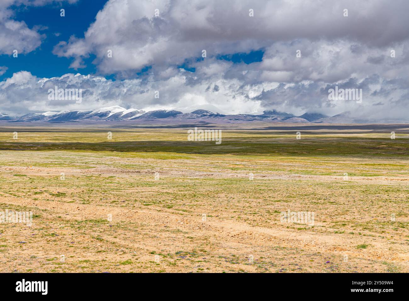 Panoramic view of snow capped mountain ranges and cloudscape of Kunlun ...