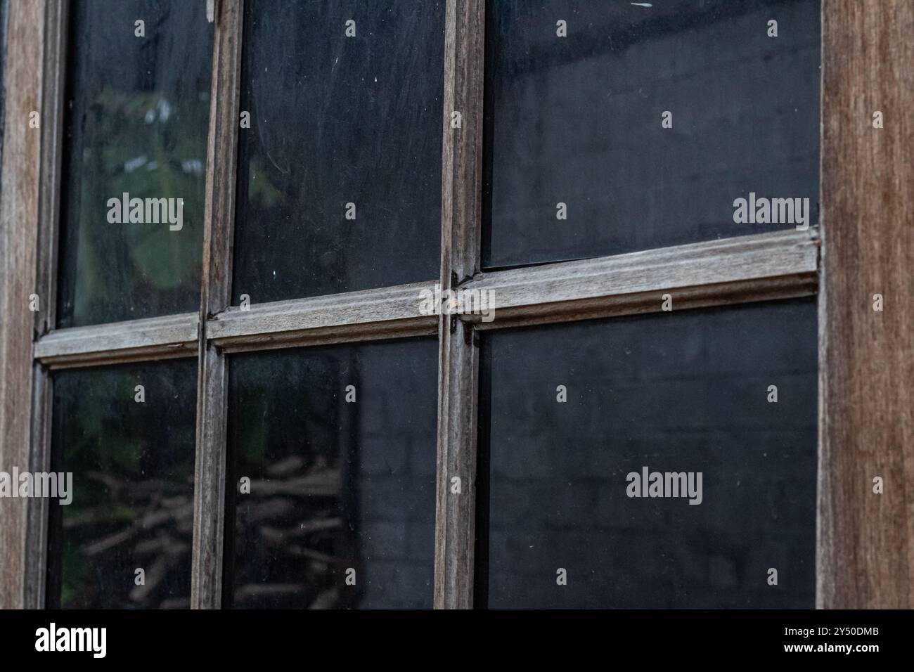 House windows with aged wood and black glass Stock Photo - Alamy