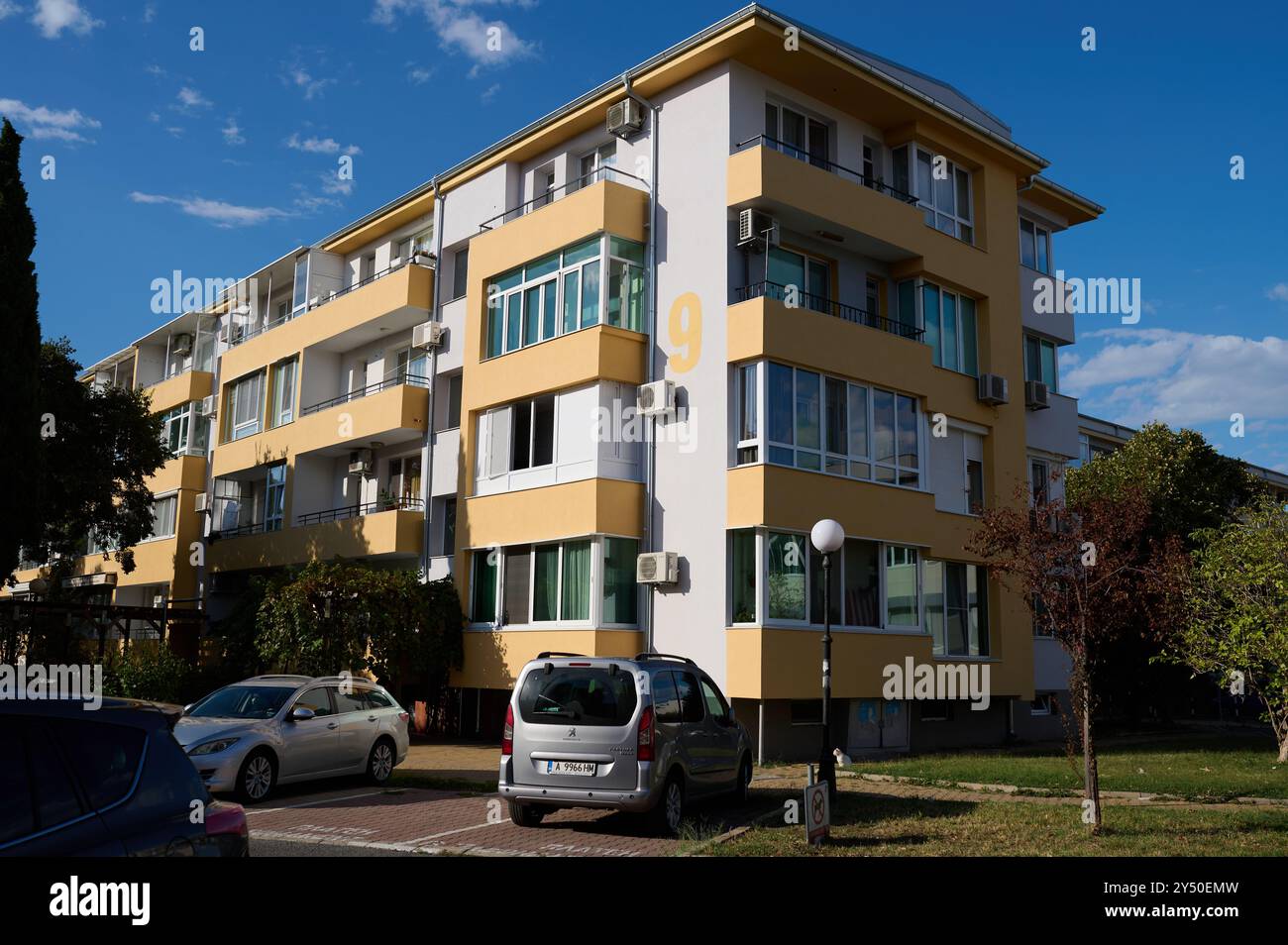 Modern architectural design featuring a four-story residential building ...