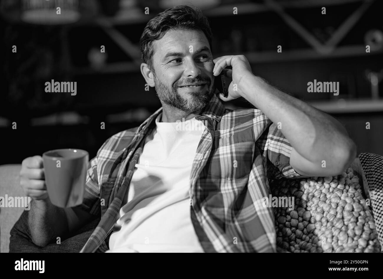 Handsome millennial guy using Black and White Stock Photos & Images - Alamy