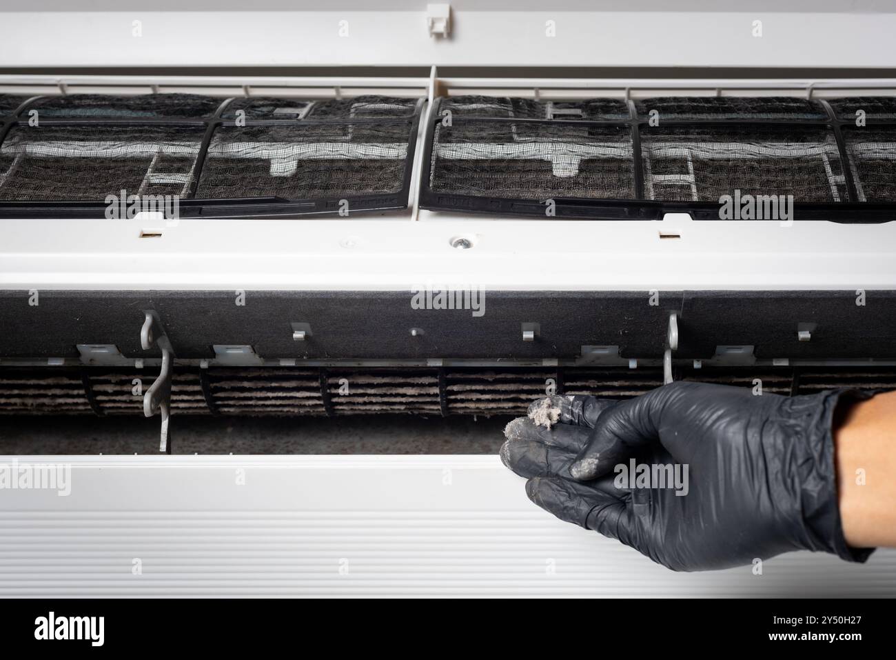 Close up dirty of air conditioner blower fan in the hand. Maintaining ...