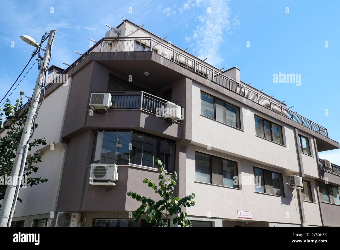Modern residential architecture with unique features and AC units in a ...
