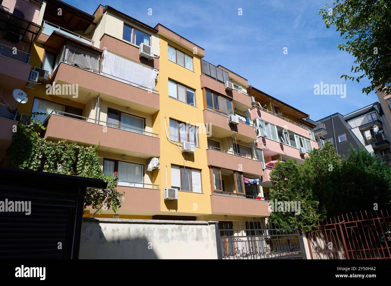 Colorful apartment buildings in a residential area showcase modern ...