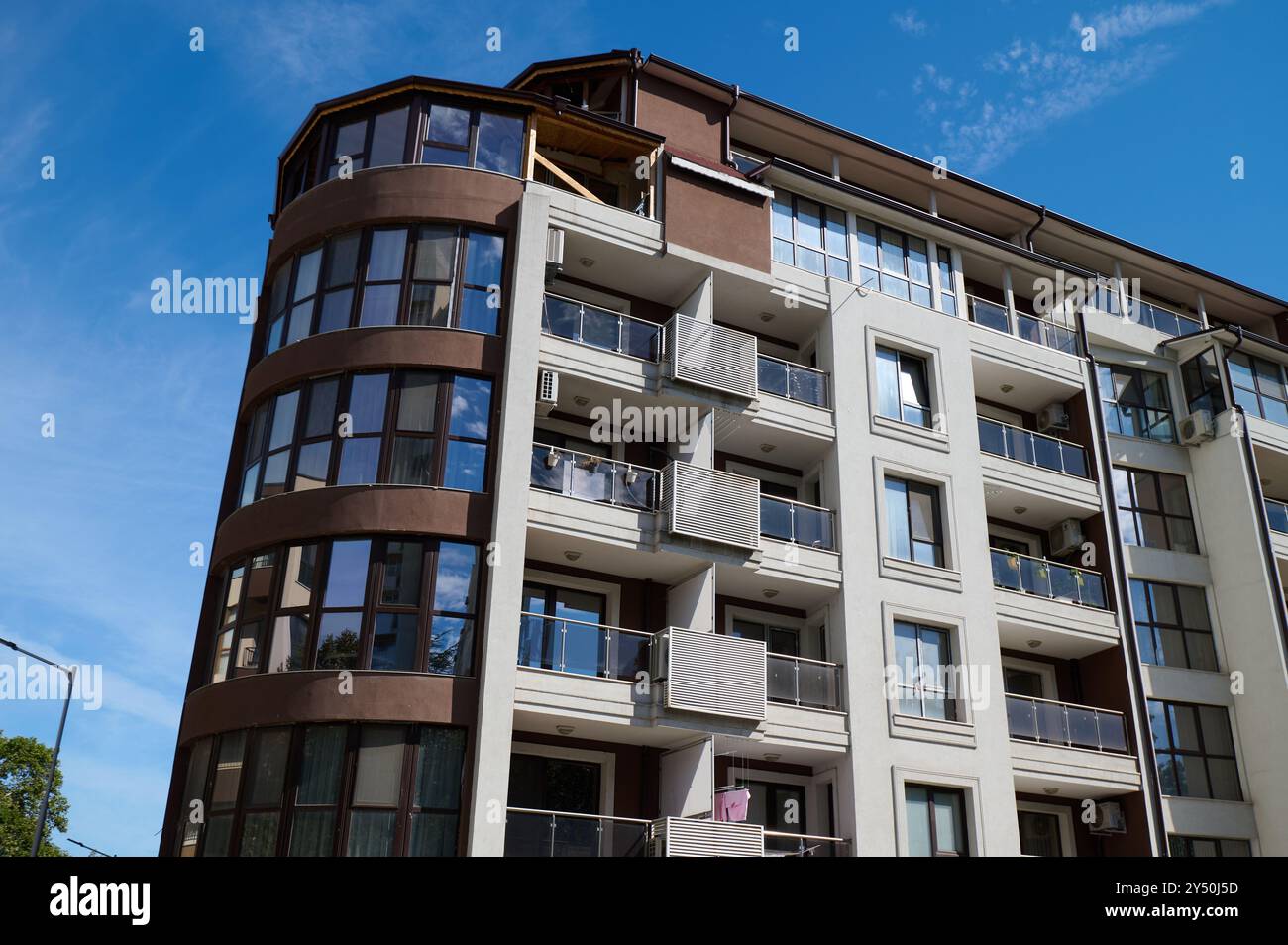 Modern residential architecture showcasing large windows and balconies ...