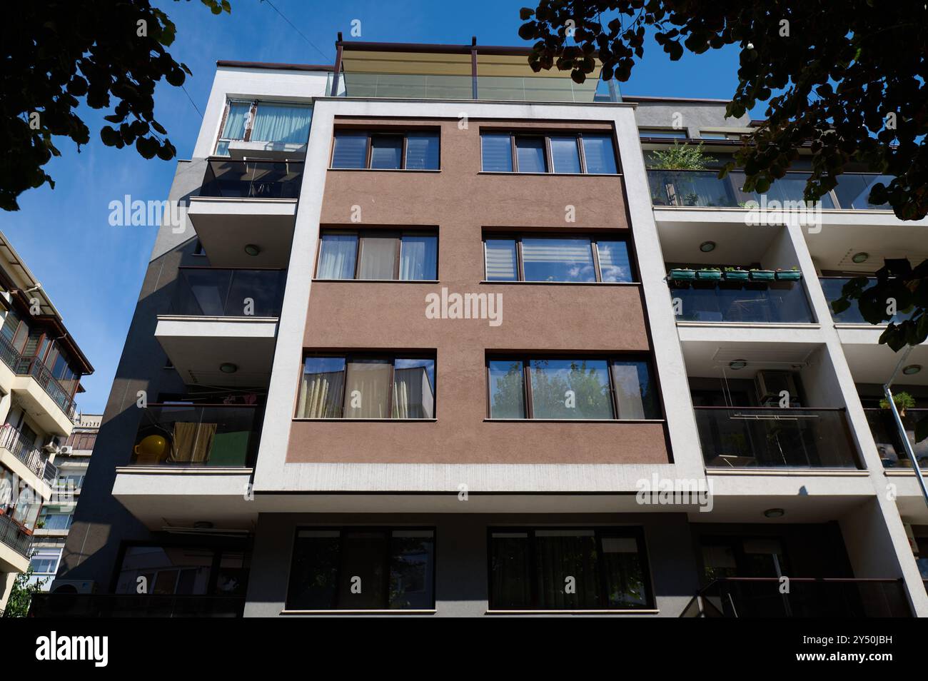Modern architectural design of an apartment building with balconies and ...