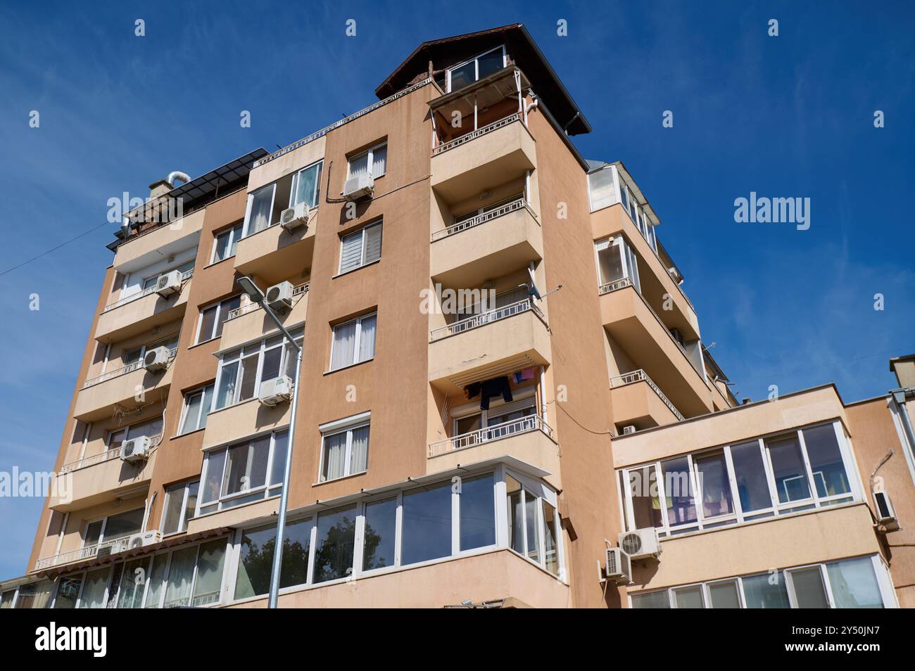 Modern apartment building featuring large windows and a distinctive ...