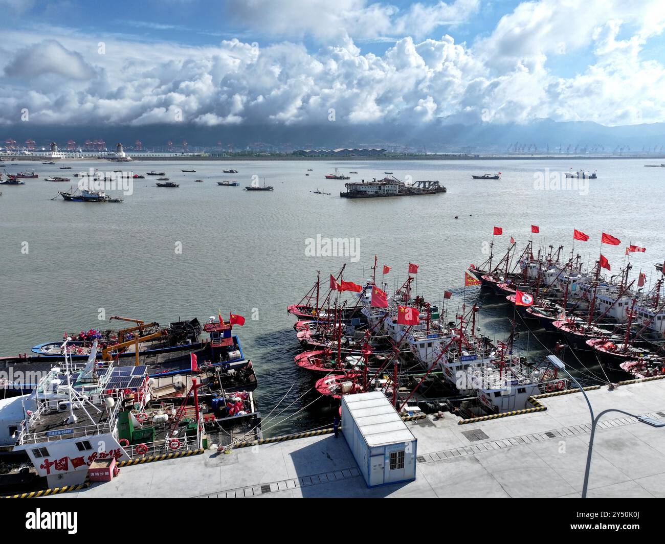 Aerial photo shows fishing vessels anchoring at a harbor to avoid ...