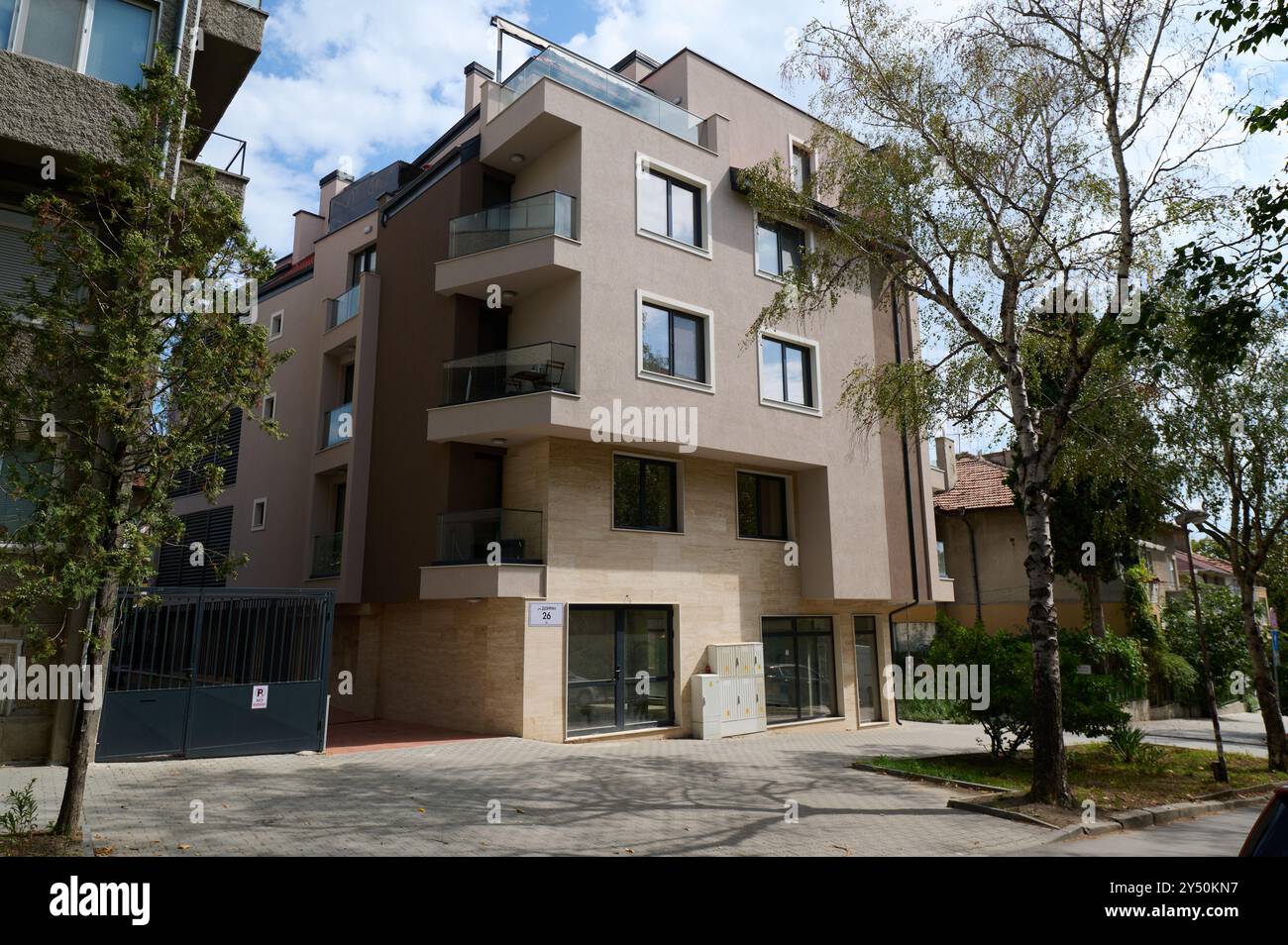 Modern architectural design featuring a four-story residential building ...