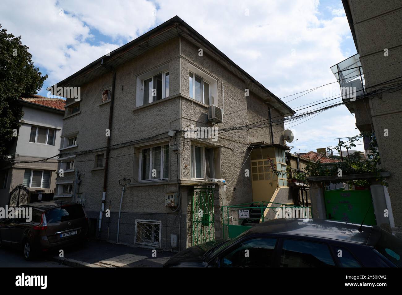 Residential building featuring classic architecture on a quiet street ...