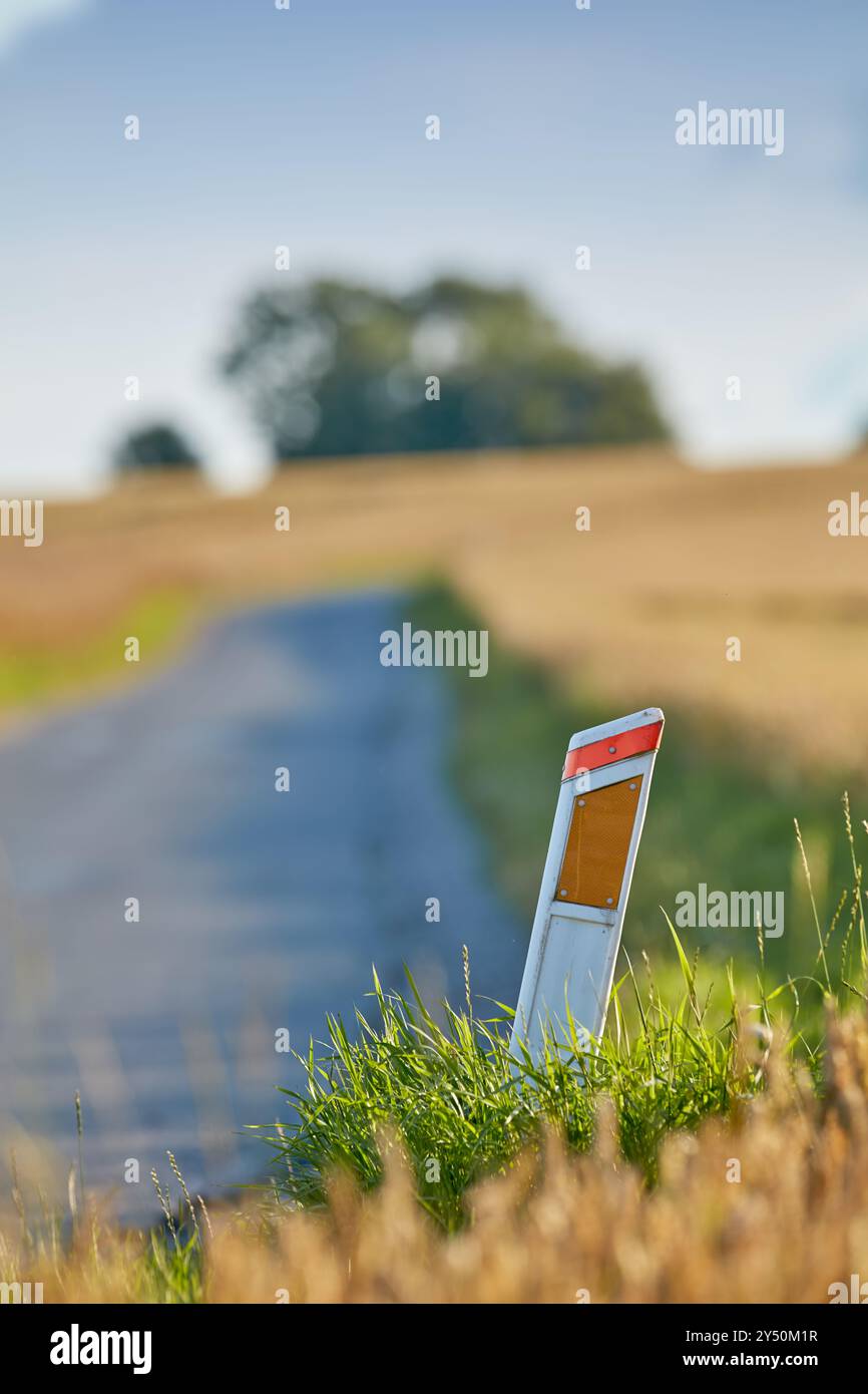 Reflector, post and road for travel outdoor in nature for vehicle guide ...