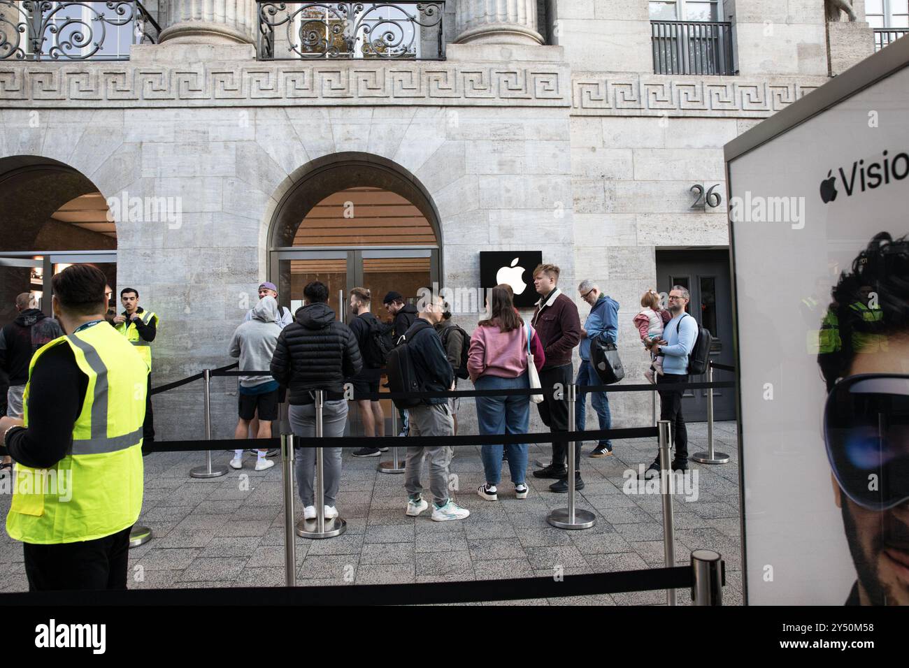 Dozens of eager consumers lined up outside the Apple Store on ...