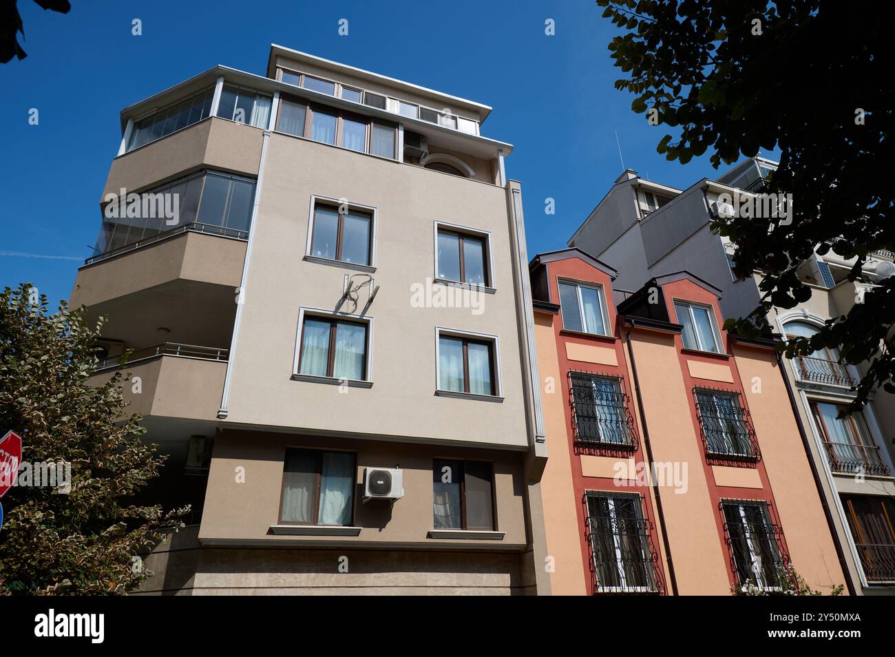 Modern architectural design of a mixed-use building in an urban setting ...