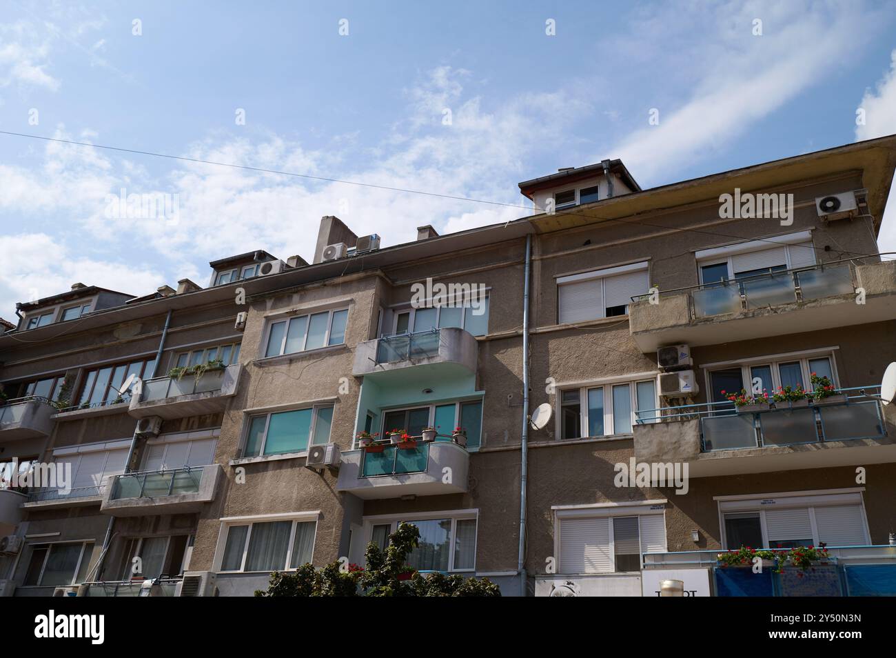 Modern apartment building with balconies and air conditioning units ...