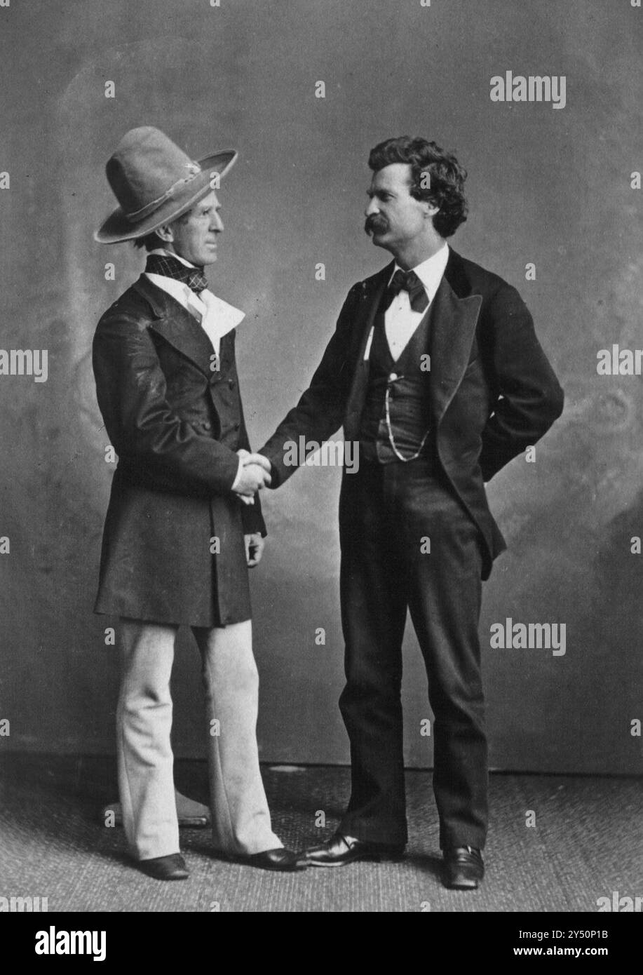 Mark Twain in a handshake with John T. Raymond, the actor who played ...