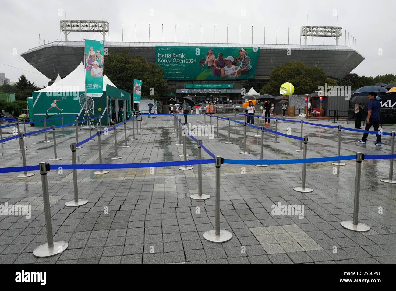 An empty ticketing area is seen as rain delays the start of matches of ...