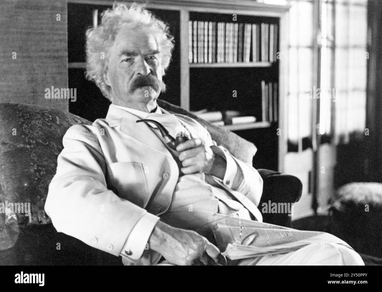 Samuel Langhorne Clemens, three-quarter length portrait, seated, facing ...