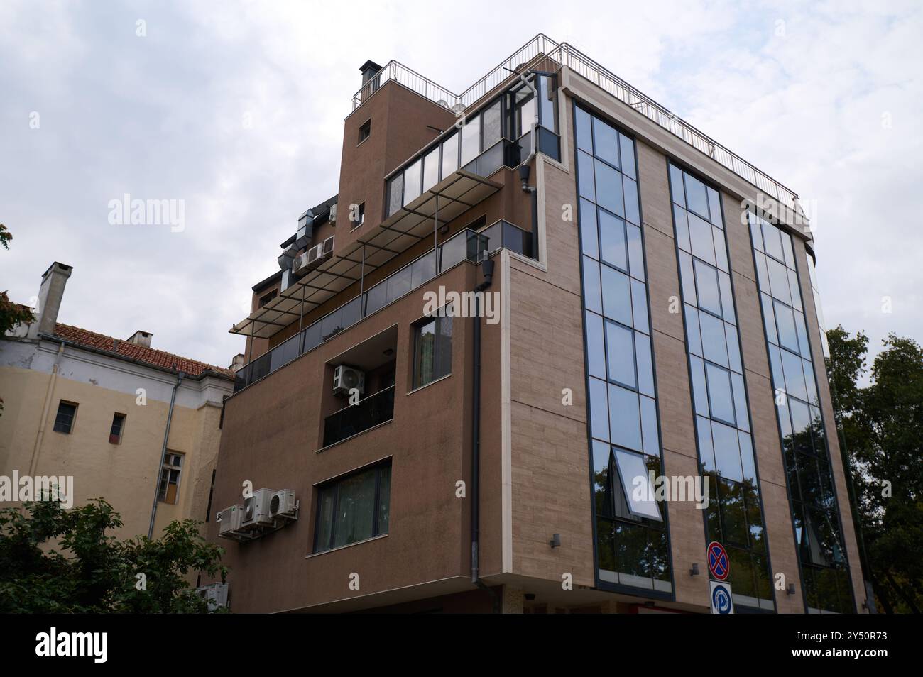 Modern architectural design featuring large glass windows in a multi ...