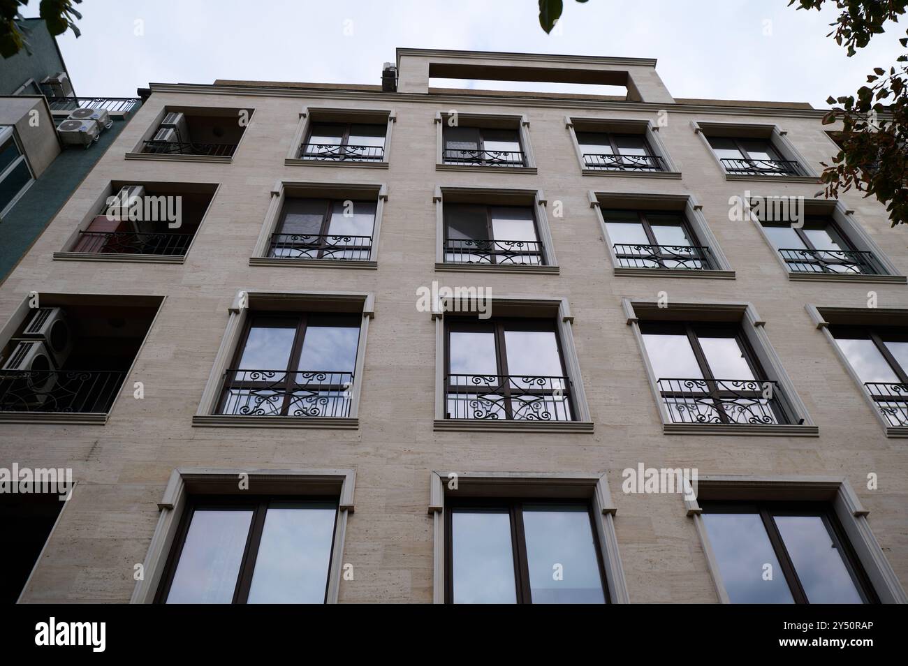 Modern architectural design featuring multiple windows and balconies in ...