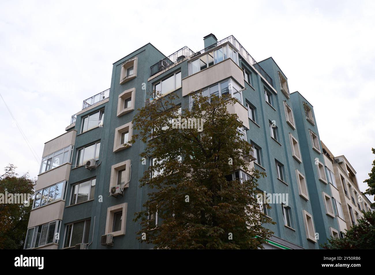 Modern multi-story building featuring unique architecture in a city ...