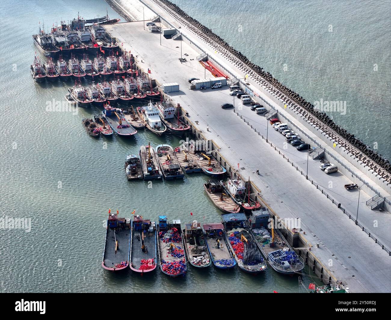 Aerial photo shows fishing vessels anchoring at a harbor to avoid ...