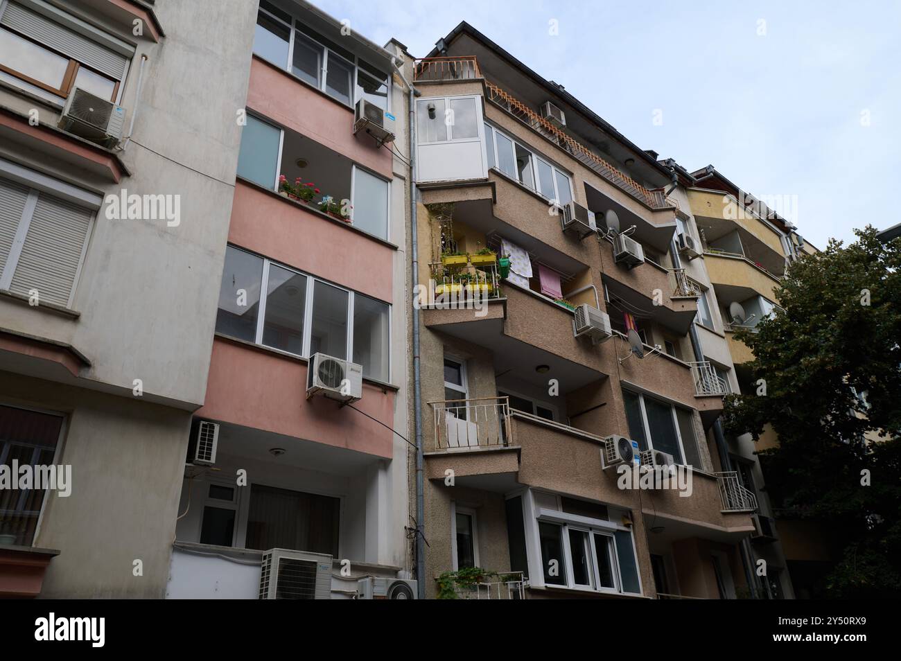 Residential architecture in an urban area showcasing balconies and air ...