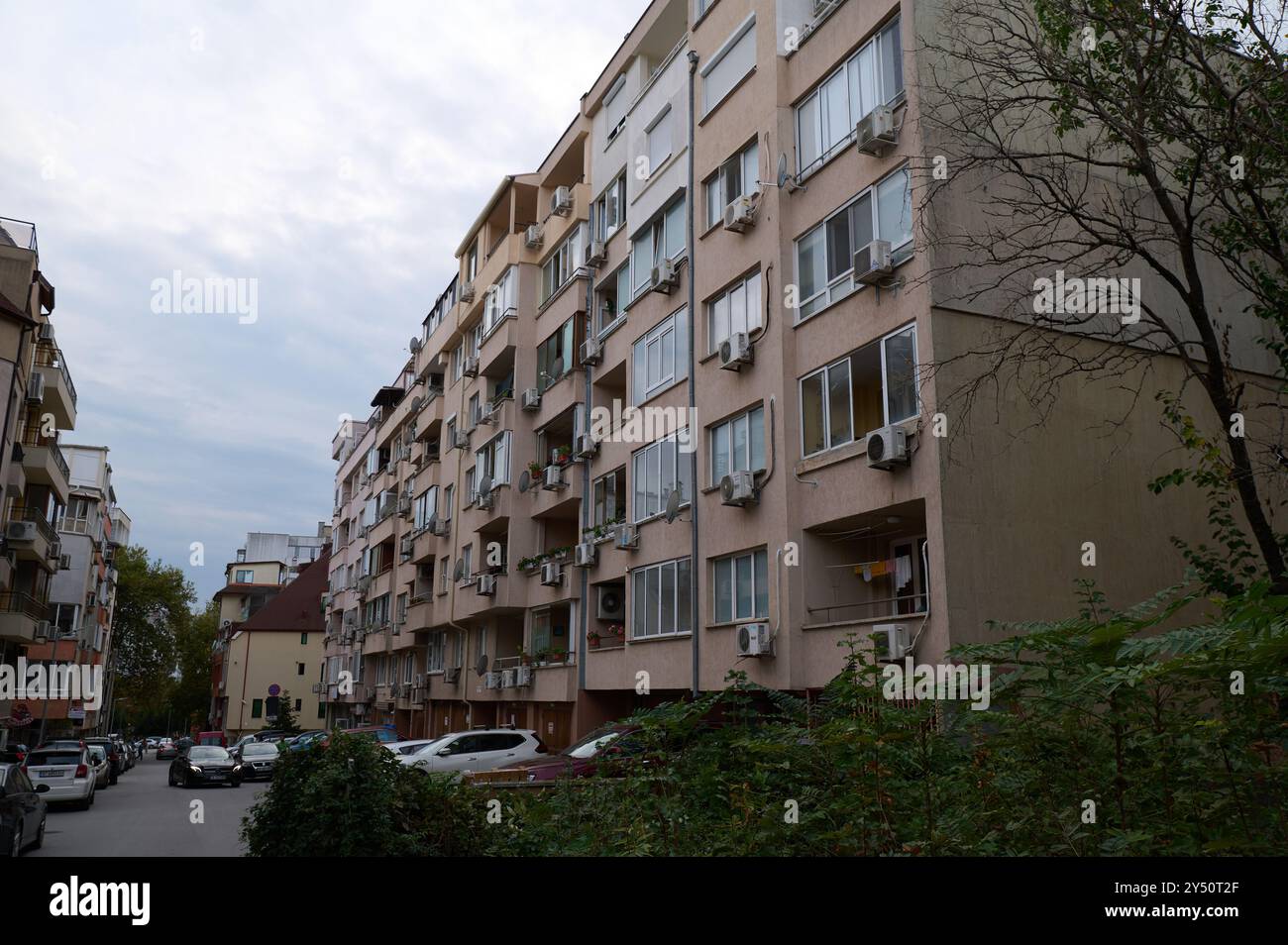 Multi-story residential building with balconies and air conditioning ...