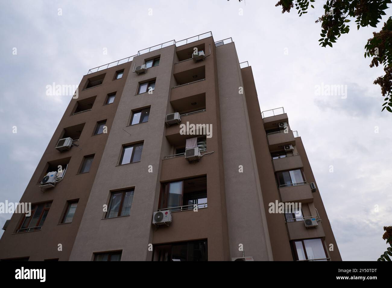 Contemporary residential building with balconies and air conditioning ...