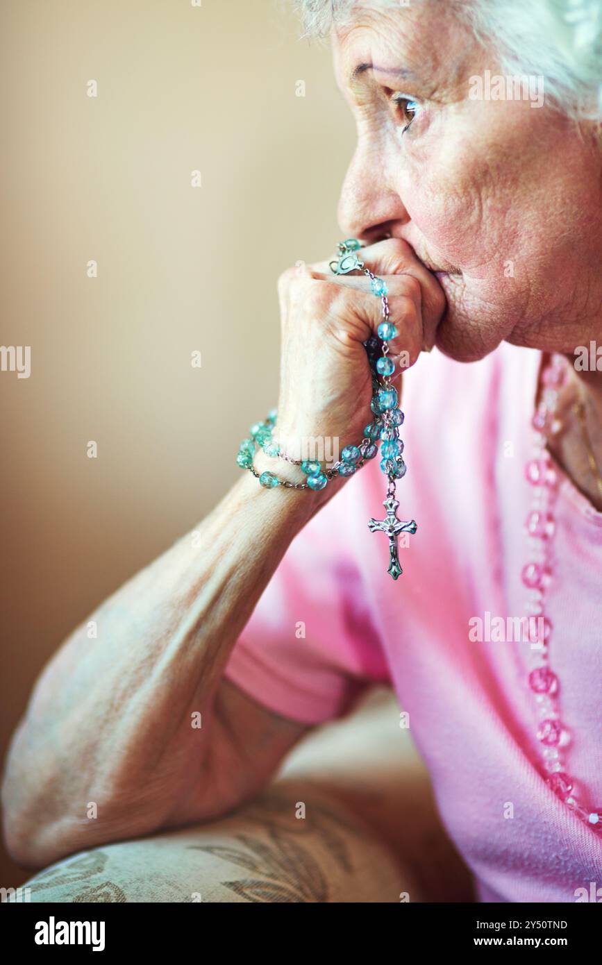 Old woman, religion and rosary beads in home, spiritual worship and ...