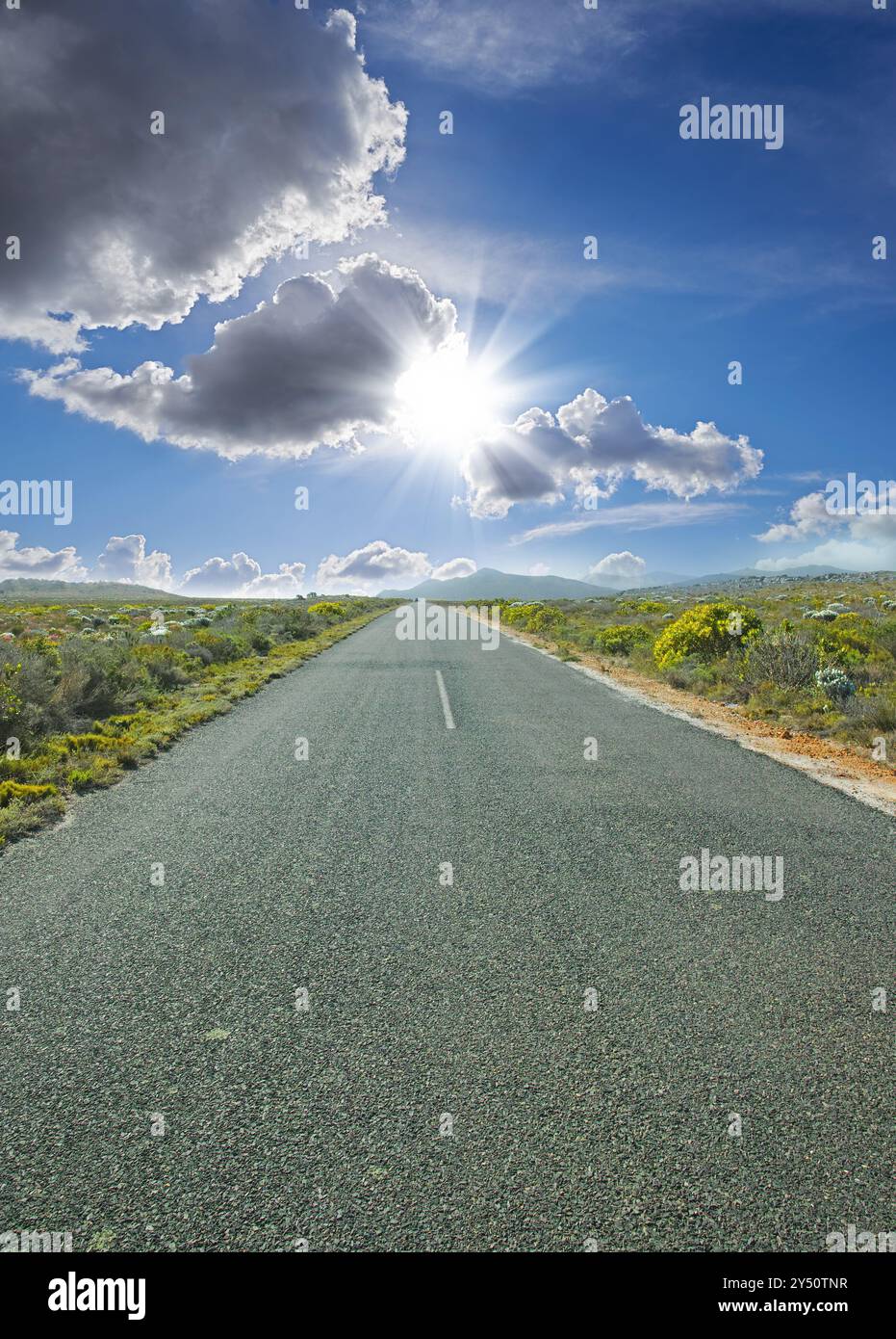 Cloudy sky, countryside and road with nature for trip, drive and travel ...