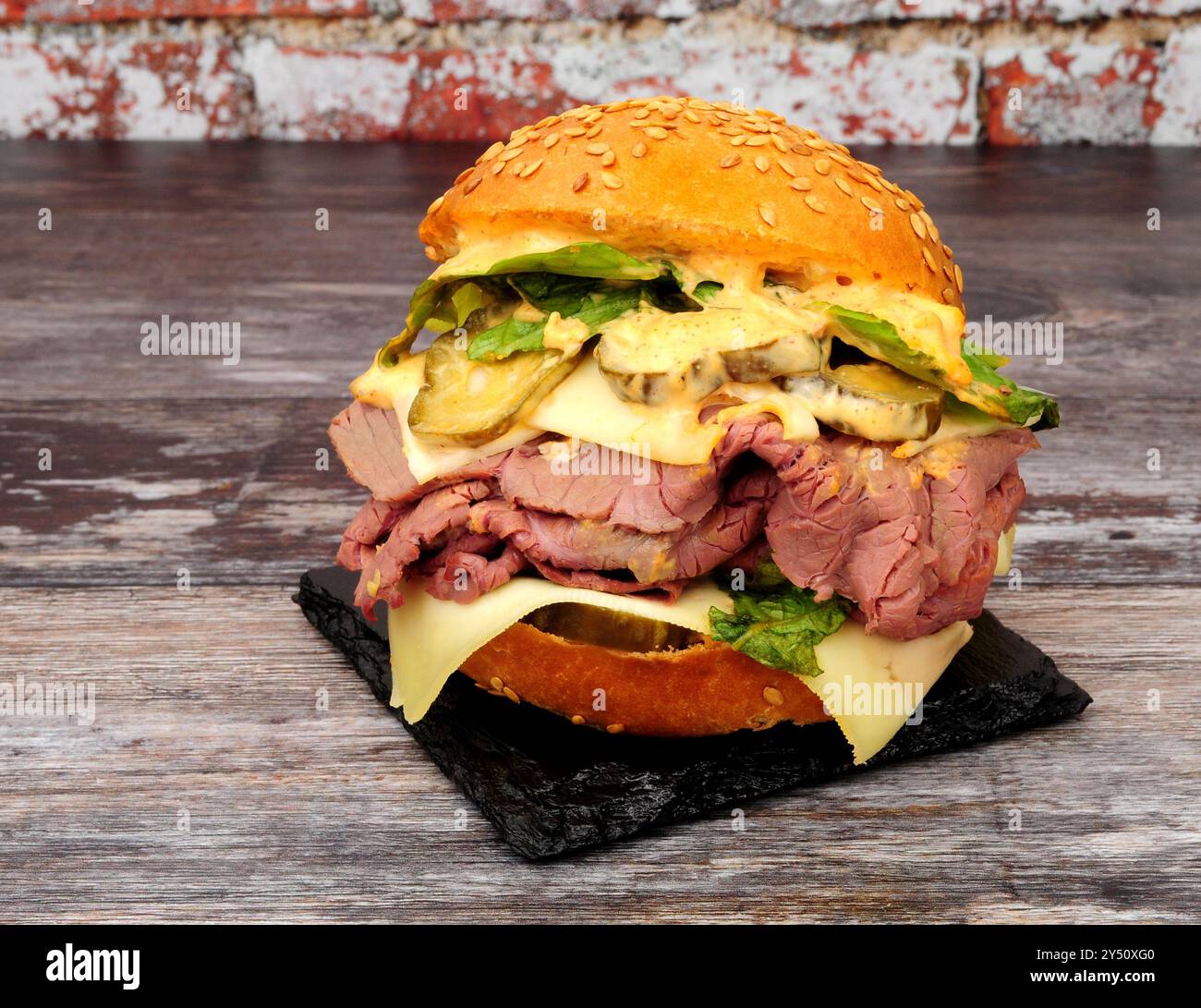Roast beef sandwich roll with burger sauce, Emmental cheese and lettuce ...