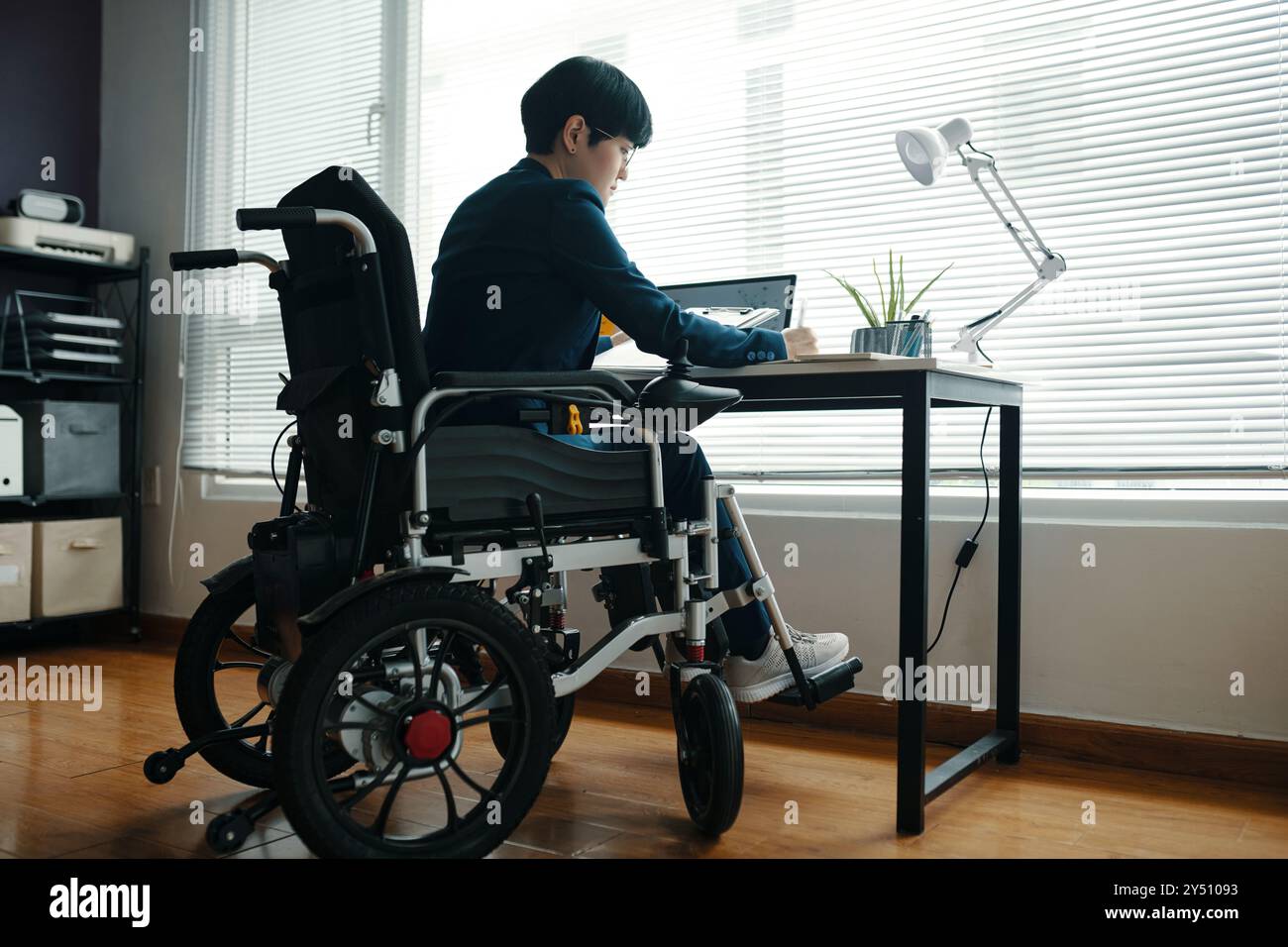 Woman With Disability Working In Office Stock Photo - Alamy
