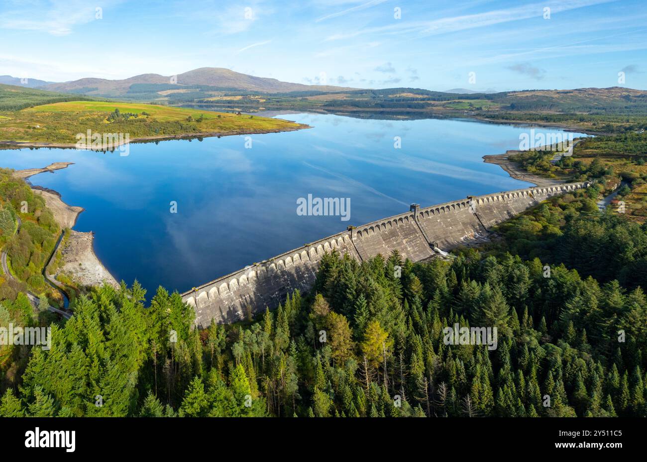 Aerial view from drone of dam on Clatteringshaws Reservoir ( loch) in ...