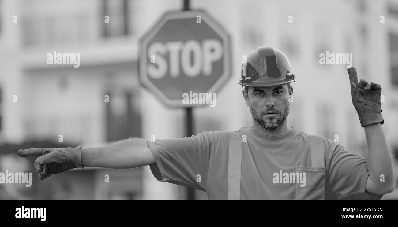 Builder with stop road sign. Builder with stop gesture, no hand ...