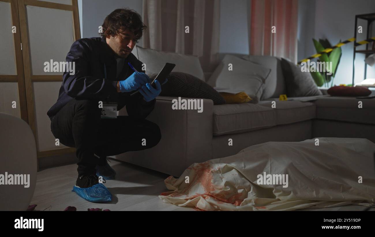 Young hispanic male detective analyzes clues at indoor crime scene with ...