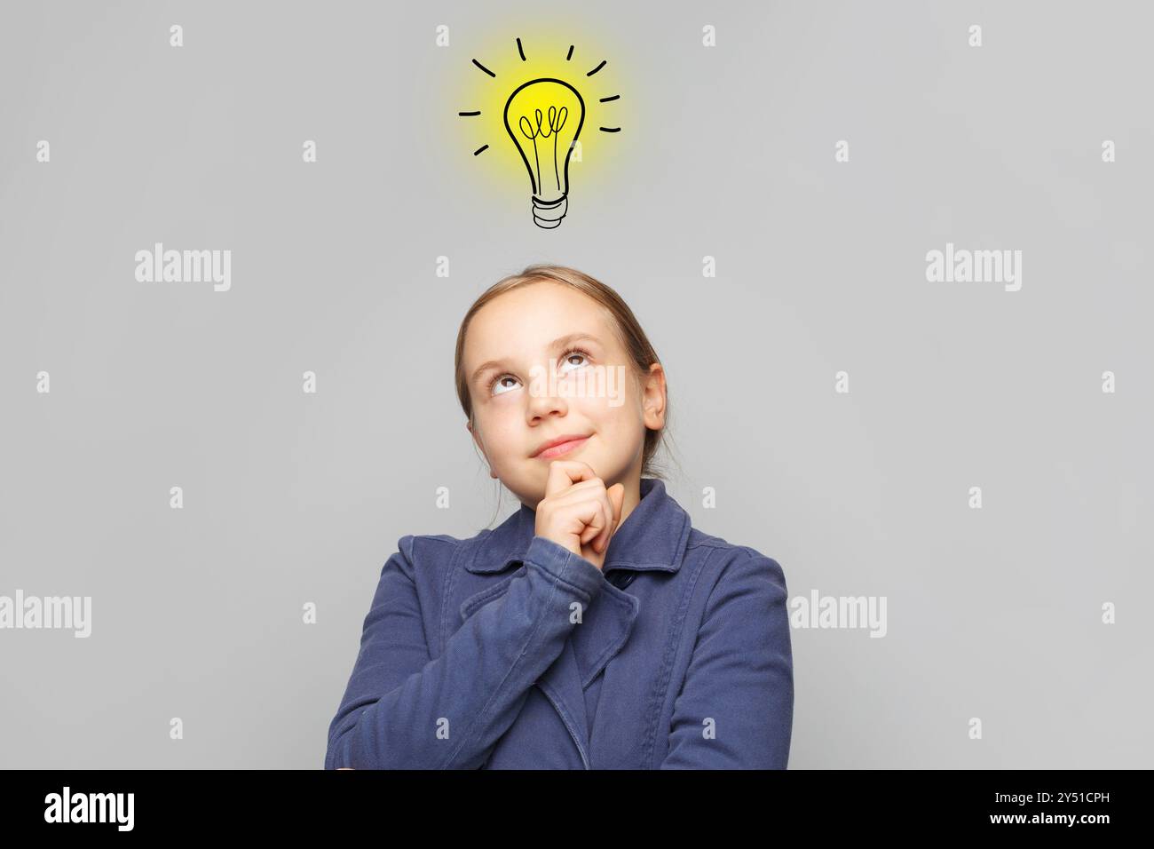 Pretty thinking child girl with light bulb on white background ...