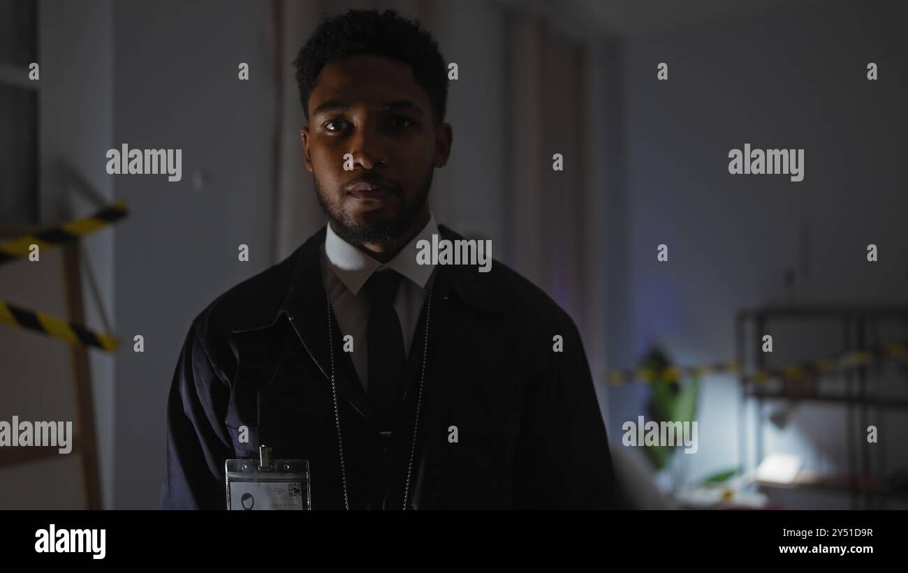 African american detective in suit investigates crime scene indoors ...