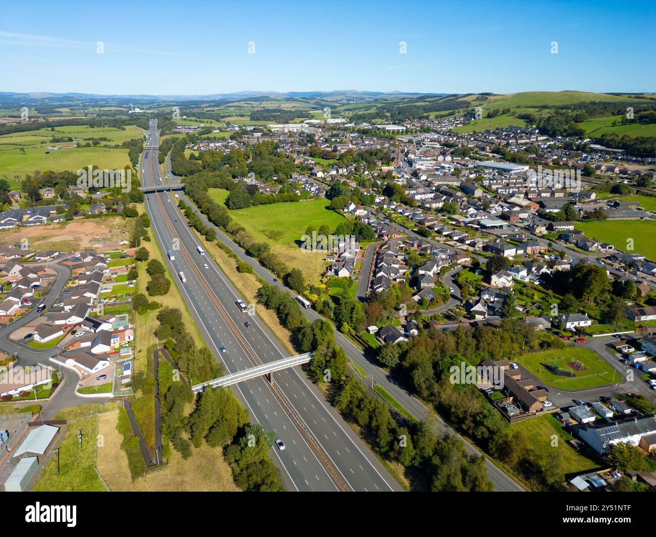 Aerial view from drone of M74 Motorway passing through Lockerbie in ...