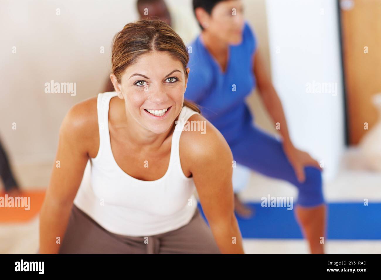 Woman, portrait and instructor at yoga class, exercise and gym for ...