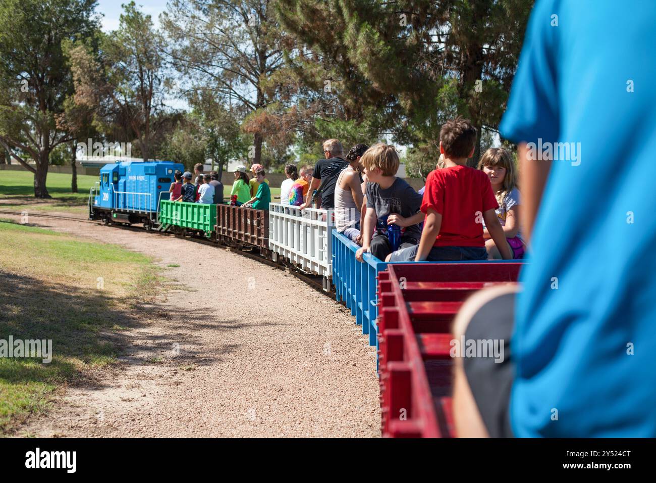 People ride a train at a Railroad Park in Scottsdale, AZ Stock Photo ...