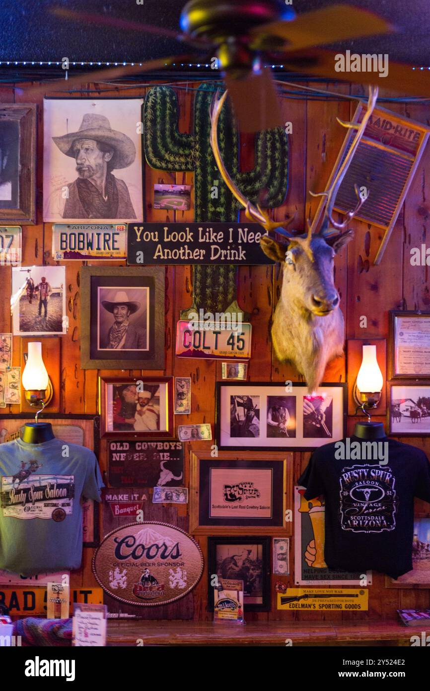 A collage of items on a wall inside a bar Stock Photo - Alamy