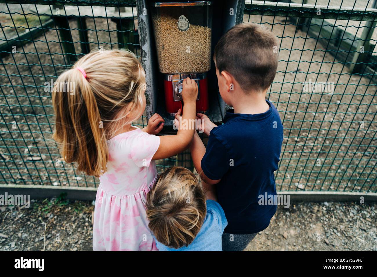Children gathered around small hi-res stock photography and images - Alamy