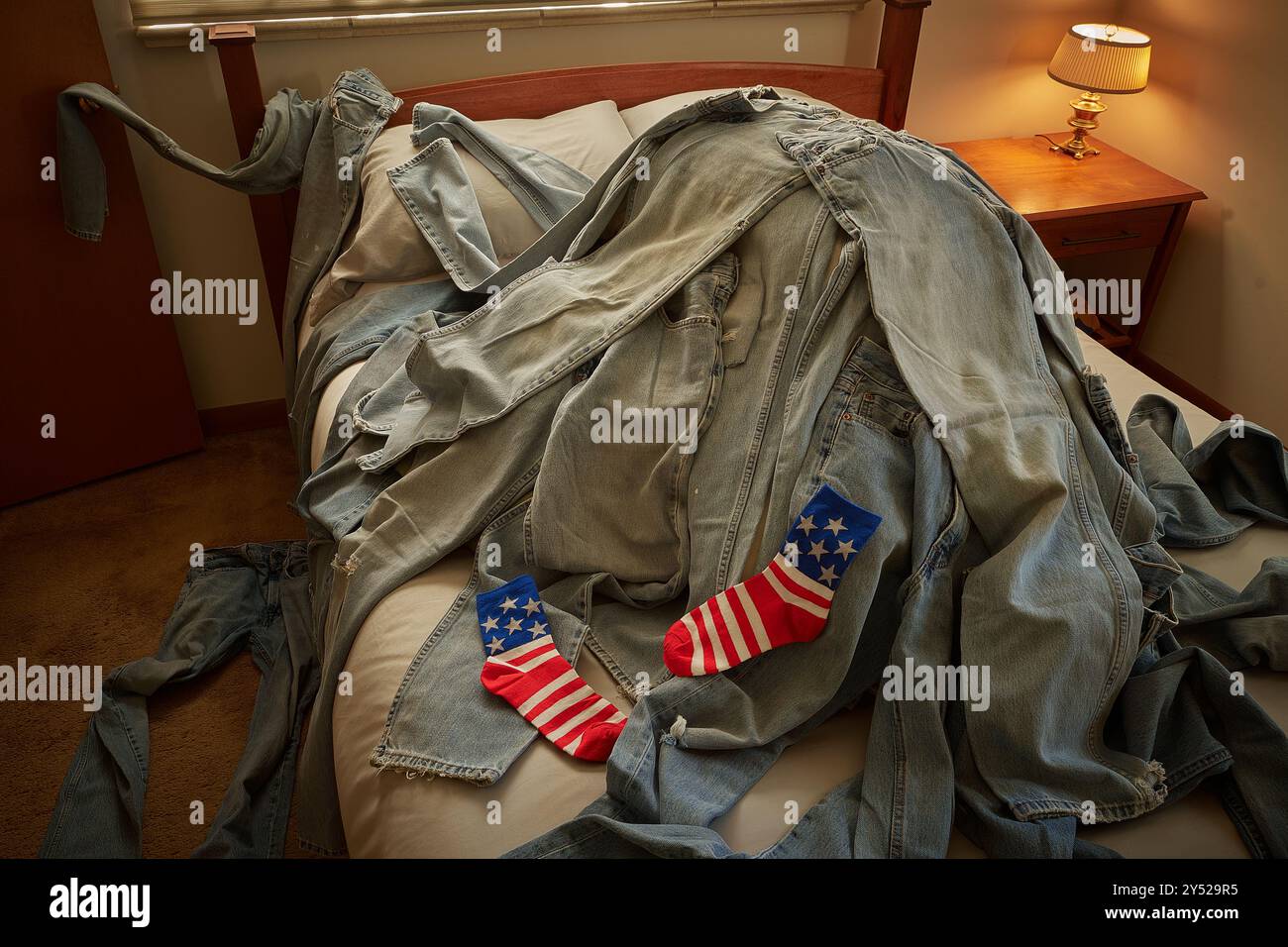 Dirty laundry tossed on bed Stock Photo - Alamy