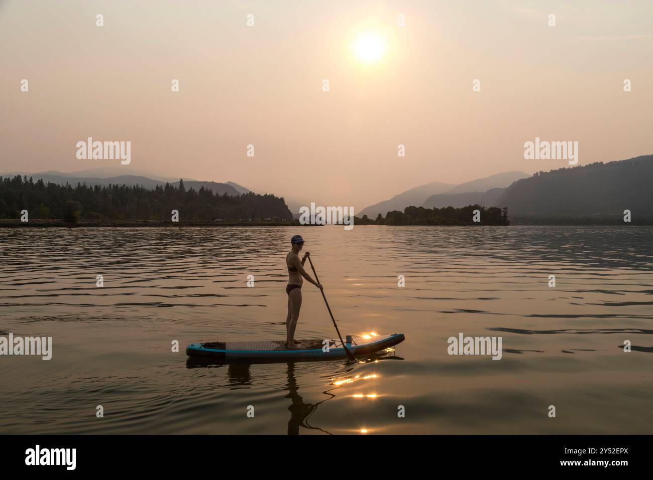 Woman enjoys setting sun hi-res stock photography and images - Alamy