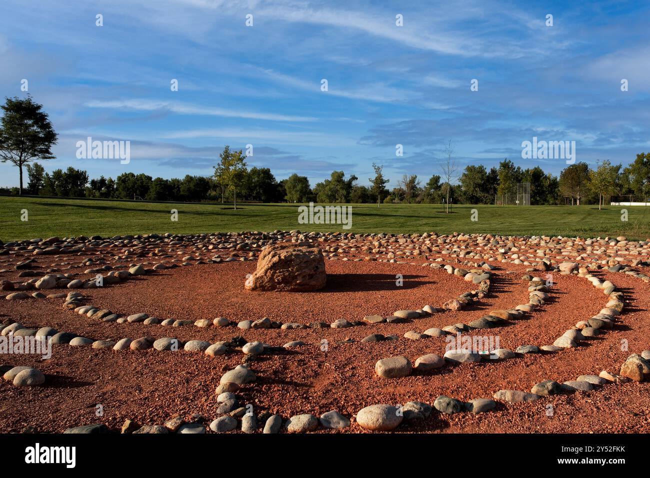 Labyrinth circle made with rocks Stock Photo - Alamy