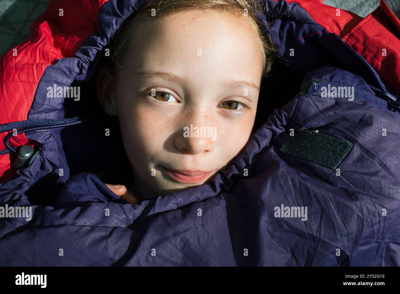 child wrapped up in a sleeping bag whilst camping Stock Photo - Alamy