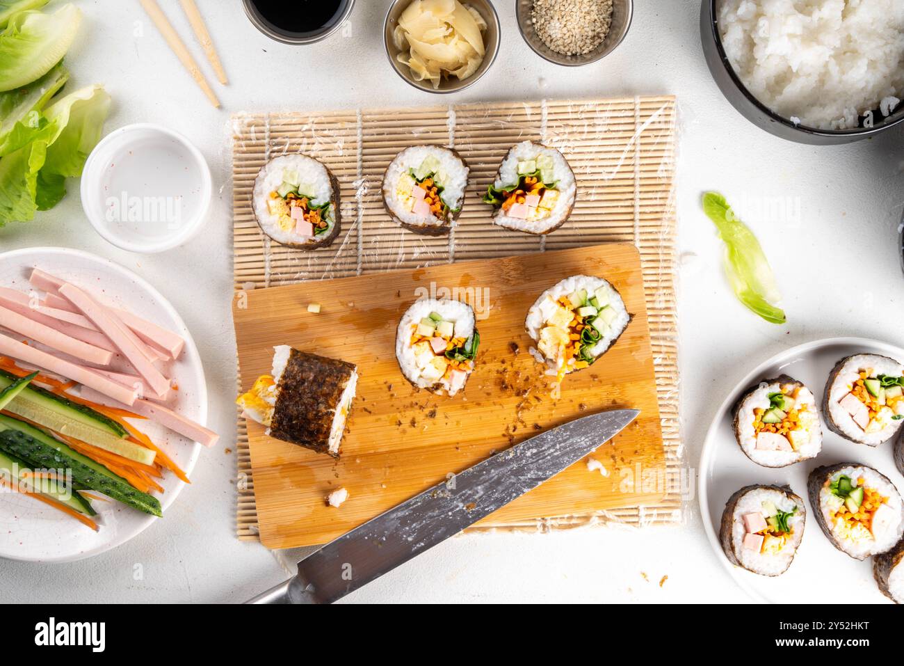 Traditional Korean food kimbap, with ham, vegetables and lettuce ...